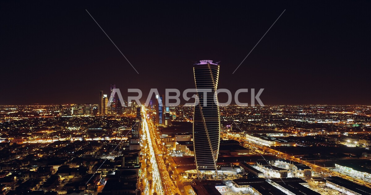 Enjoying the tranquil night scenery, the Majdool Tower in the skyline ...
