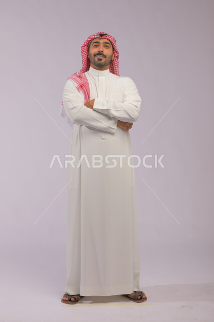 An important Saudi figure standing with his hands folded, the concept ...