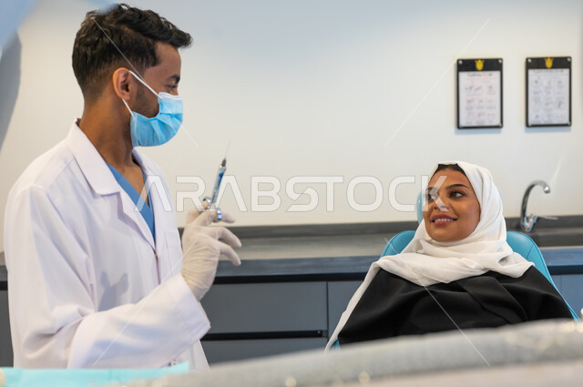 Local anesthetic injections to relieve pain, tooth restoration with ...