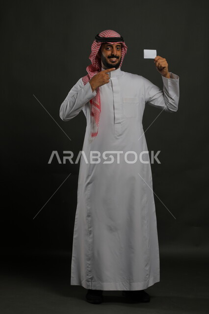 Standing and pointing to a personal identification business card with ...