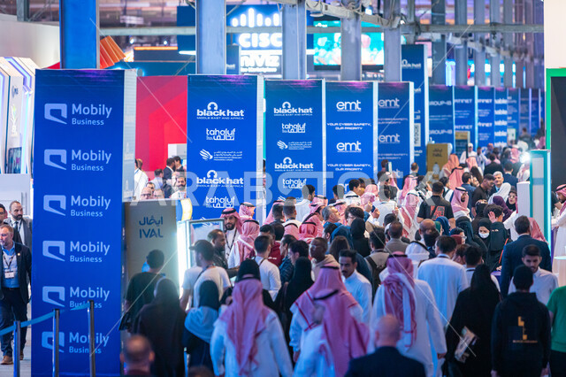 Crowded visitors in the corridors of the Black Hat Cybersecurity ...