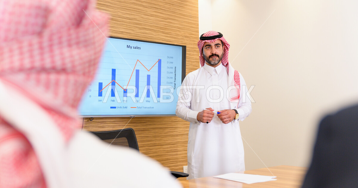 A Saudi businessman explains the company's strategies to his colleagues ...
