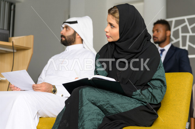 Saudi trainees in a training course, businessmen and a businesswoman in ...