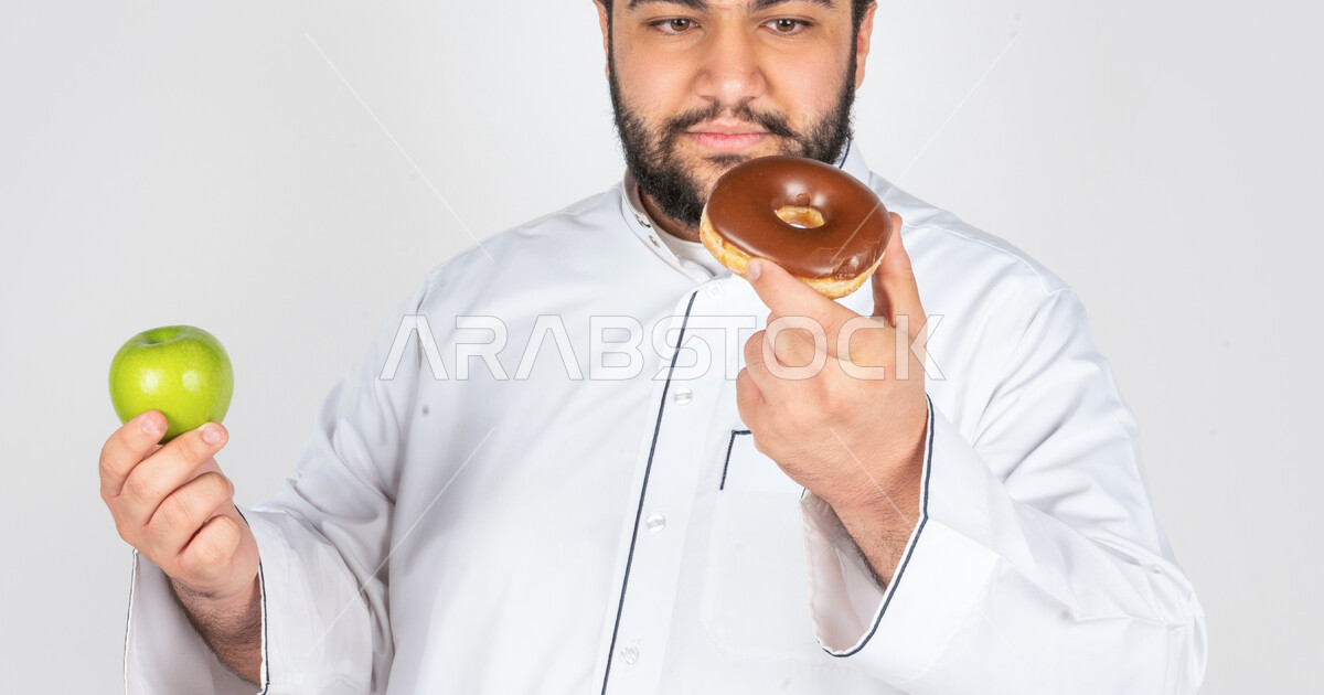 Portrait of a fat young Saudi Arabian Gulf man who is the best between ...