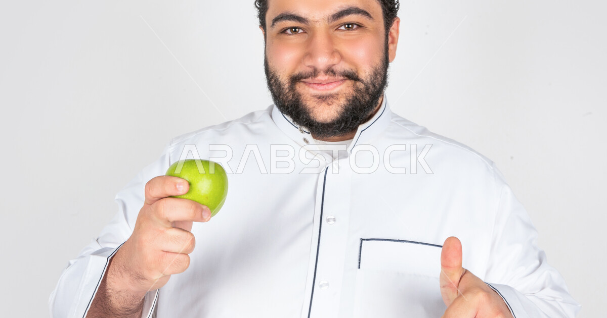 Portrait of a fat young Saudi Gulf Arab who follows a diet and ...