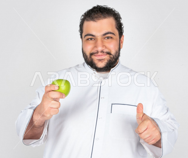 Portrait of a fat young Saudi Gulf Arab who follows a diet and ...