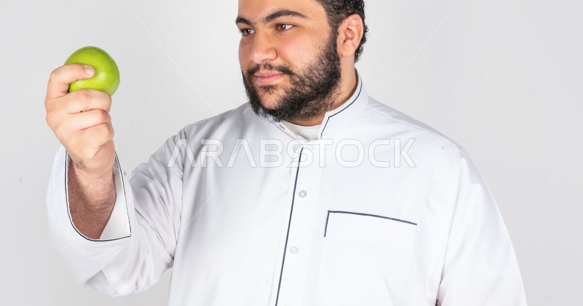 Portrait of a fat young Saudi Gulf Arab who follows a diet and ...