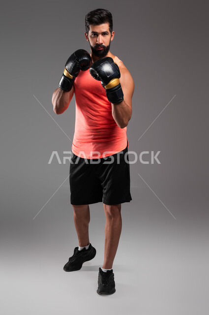 Practicing combat movements, portrait of a Saudi Arabian Gulf boxer ...