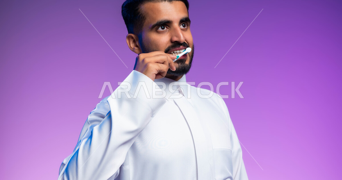 Daily oral hygiene routine, close-up portrait of a Saudi Arabian Gulf ...