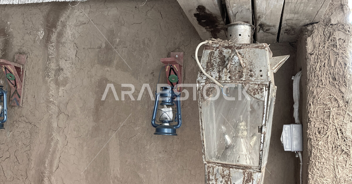 Saudi Arabian folk lanterns, a metal lantern hanging on the wall inside ...