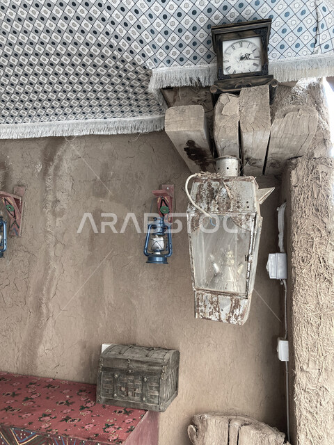 Saudi Arabian folk lanterns, a metal lantern hanging on the wall inside ...