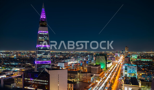 Al-Faisaliah Tower illuminated in the city of Riyadh at night, famous ...