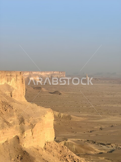The Tuwaiq mountain range in Najd in broad daylight, the rocky edge of ...