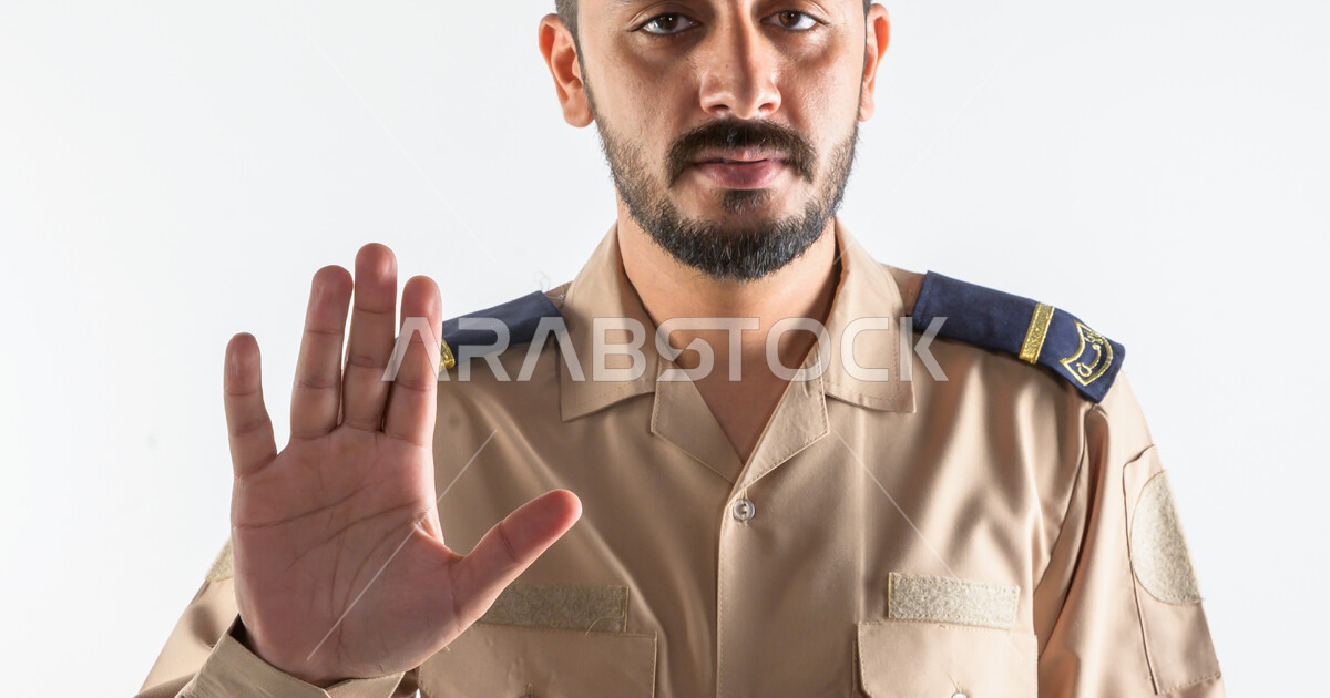 Portrait of a Saudi Arabian Gulf man working as a security man, wearing ...