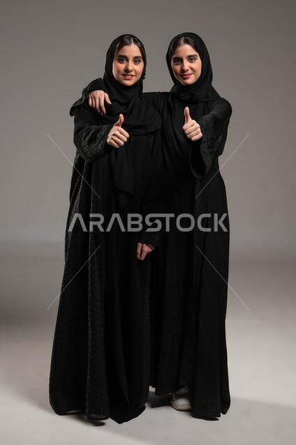 Agreeing on a certain matter, a young woman hugging her sister ...