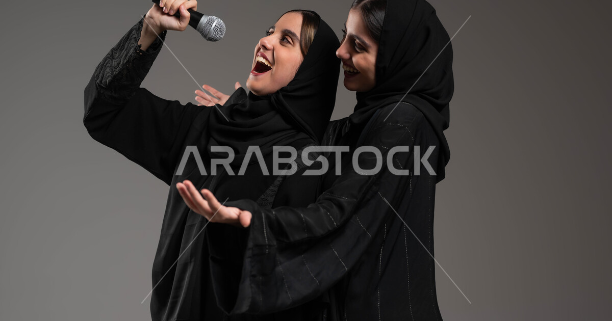 Artistic musical talents, a close-up portrait of twin Saudi Gulf Arab ...
