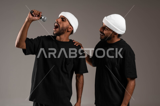 Artistic musical talents, close-up portrait of two young Saudi Gulf ...