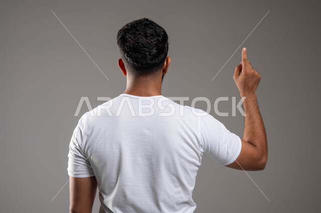 Standing straight and pointing upwards, turning and pointing at ...