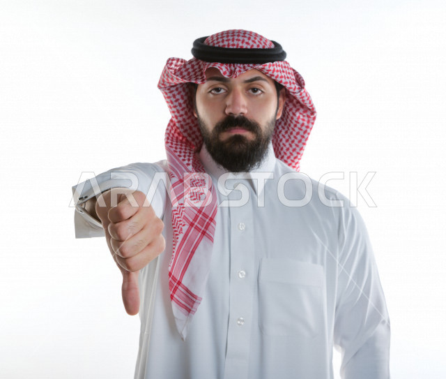 Portrait of a happy Saudi Gulf man in traditional Saudi dress, various ...