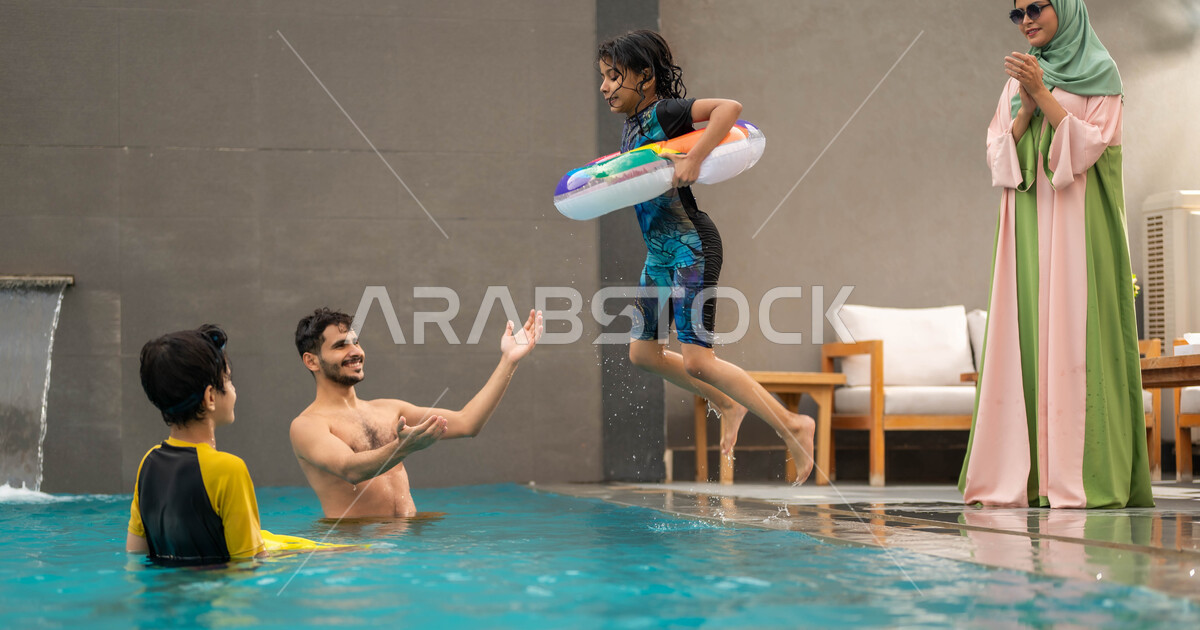 Enjoying the summer vacation with the family, a mother encouraging her ...