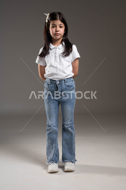 Portrait of a Saudi Arabian Gulf girl wearing a casual outfit, standing ...