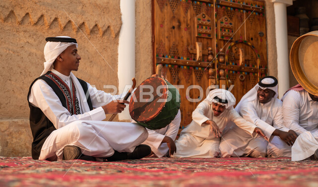 Wearing the popular Najdi Ardha costumes, a group of Saudi Gulf Arab ...