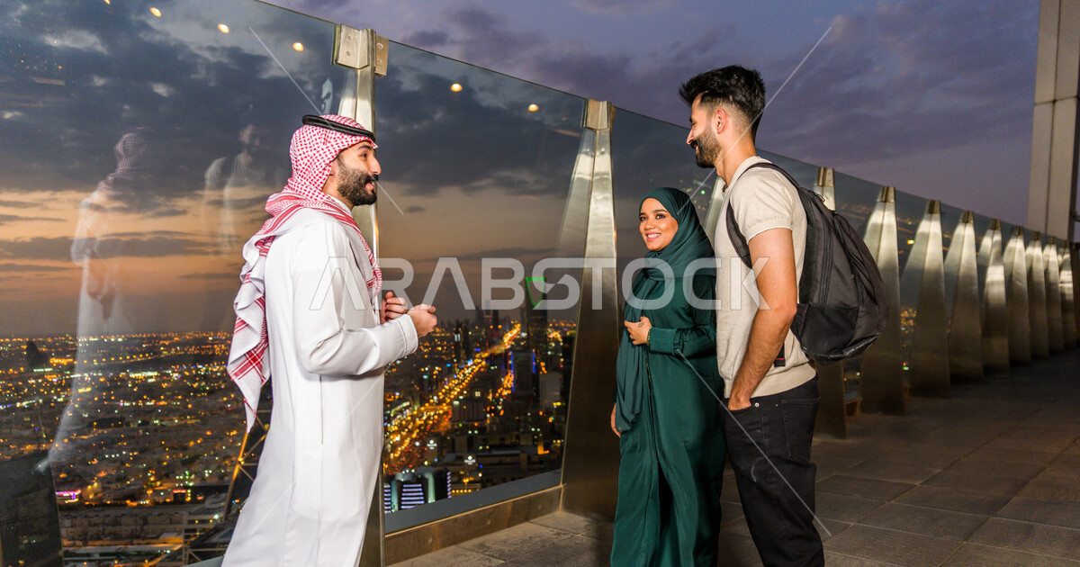 A group of people on a wonderful visit at the top of Al Faisaliah Tower ...