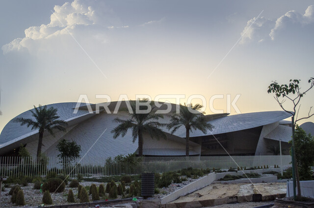 Planting green trees around the Qatar National Museum building on the ...
