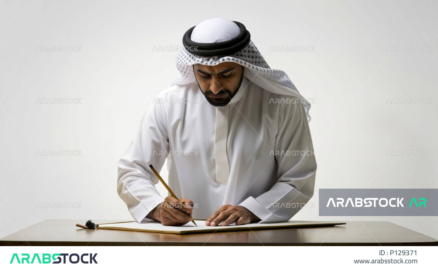 Taking and recording notes and ideas, a close-up portrait of a Saudi ...