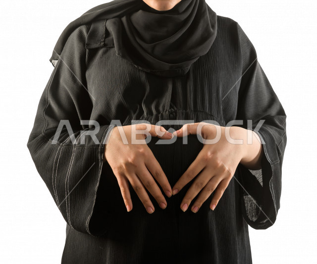 Portrait of a pregnant Saudi Arabian Gulf woman wearing a maternity ...