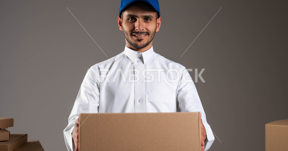 Delivering orders on time and properly, a close-up portrait of a Saudi ...