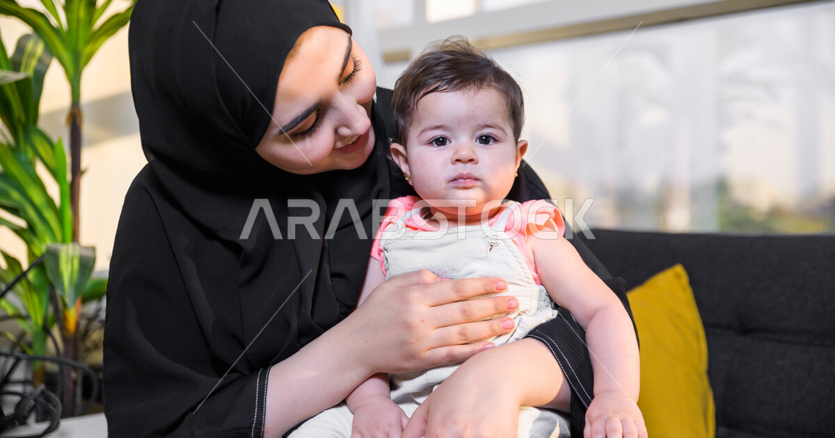 A Saudi Arabian Gulf woman with her infant son, spending time with my ...