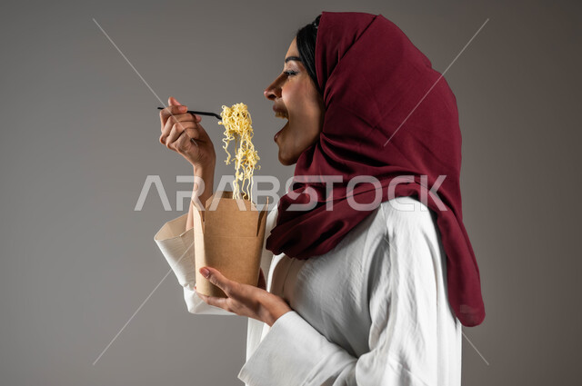 Fast food restaurants, close-up portrait from the side of a Saudi Gulf ...