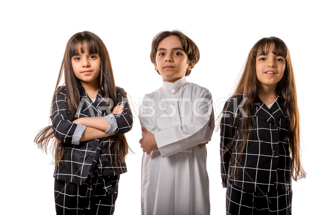 Portrait of three children of Saudi Gulf twins, face gestures ...