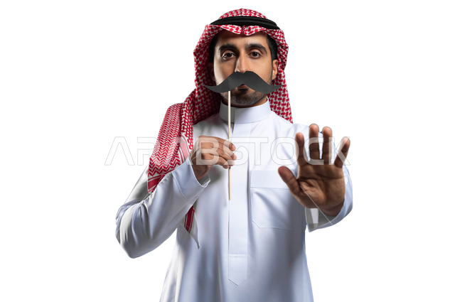 Holding a wooden stick with a piece of paper in the shape of a mustache ...
