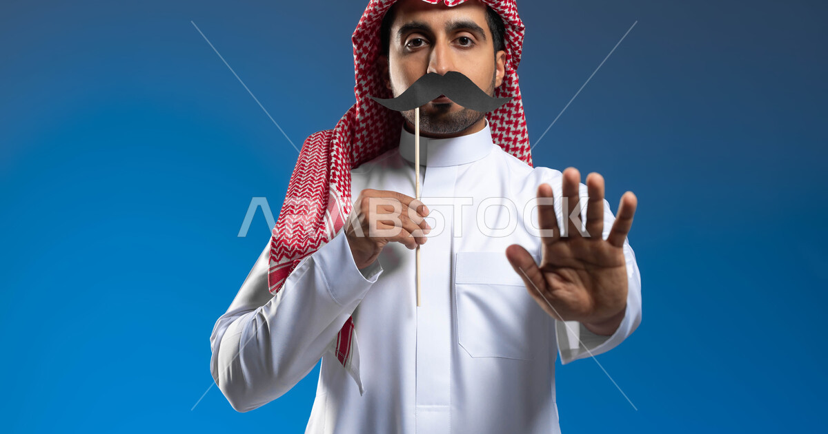 Holding a wooden stick with a piece of paper in the shape of a mustache ...