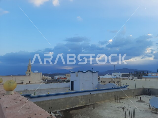 A picture from above of the rooftops and houses in the city of Al-Hujra ...