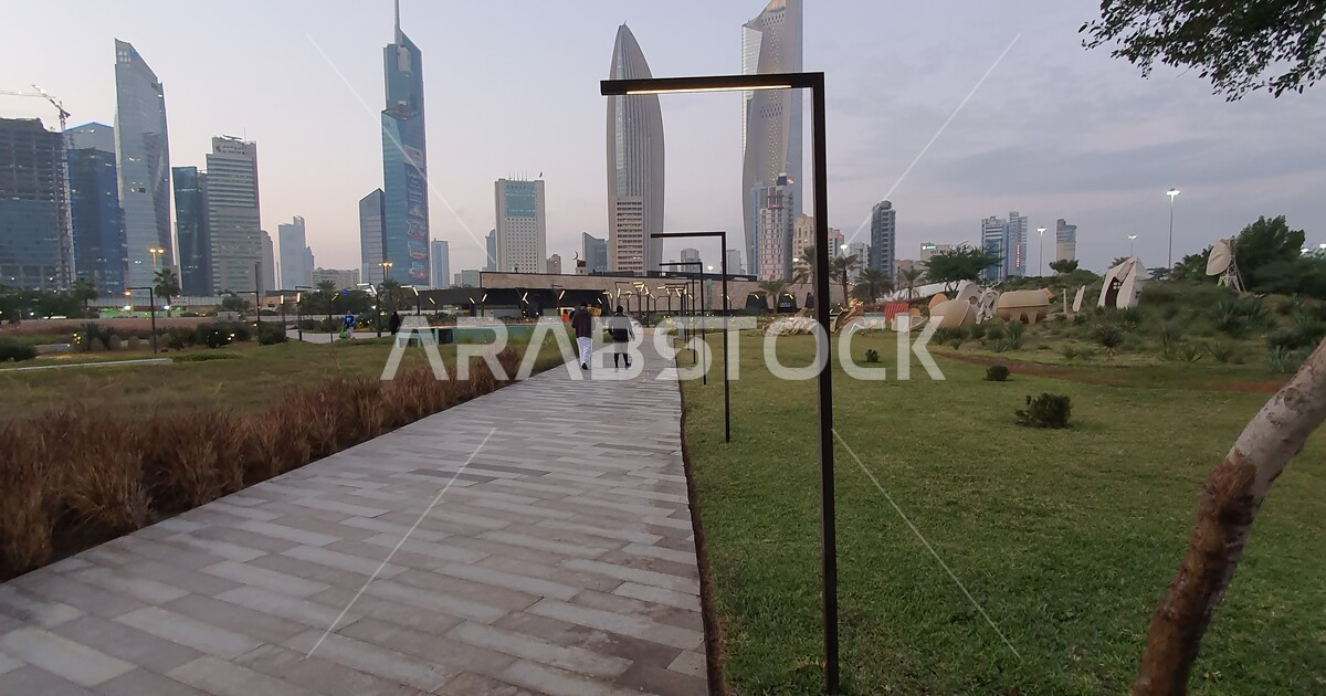 Walking and wandering paths, the view of green meadows, trees and the ...