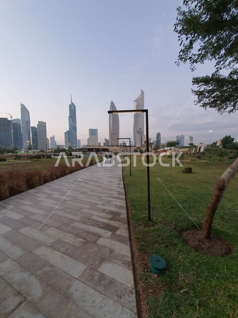 Walking and wandering paths, the view of green meadows, trees and the ...