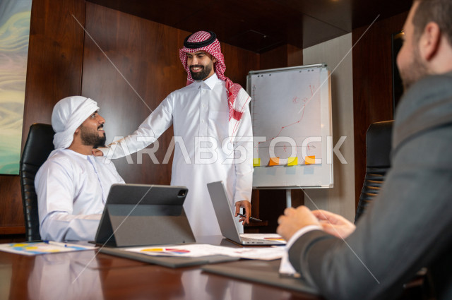 Gulf businessmen, Saudi man in a business meeting with an Emirati ...