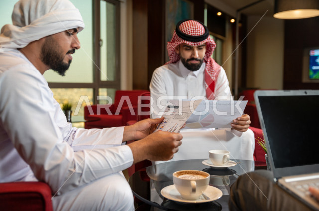 A meeting of Gulf businessmen, a Saudi man in a business meeting with ...