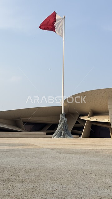 The flagpole of the State of Qatar in front of the National Museum ...