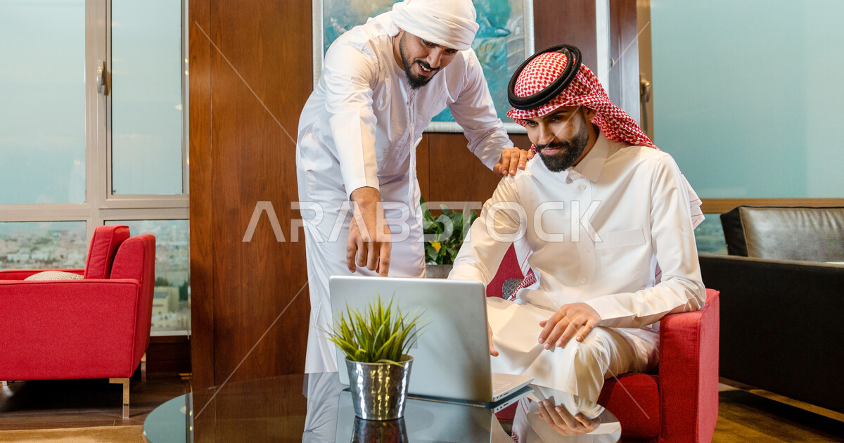 Gulf businessmen, a Saudi man in a business meeting with an Emirati ...