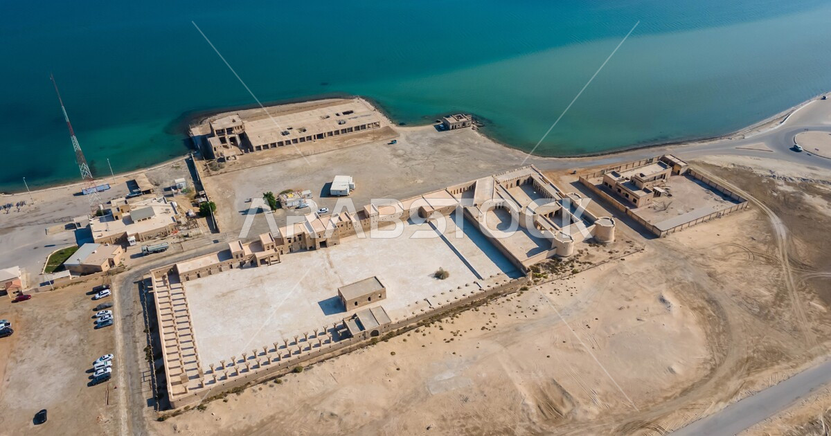 The waterfront of the ancient architecture of the port of Al-Uqair on the coast of the Arabian ...