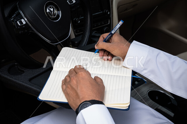 Writing and recording notes and information on paper, a close-up photo ...