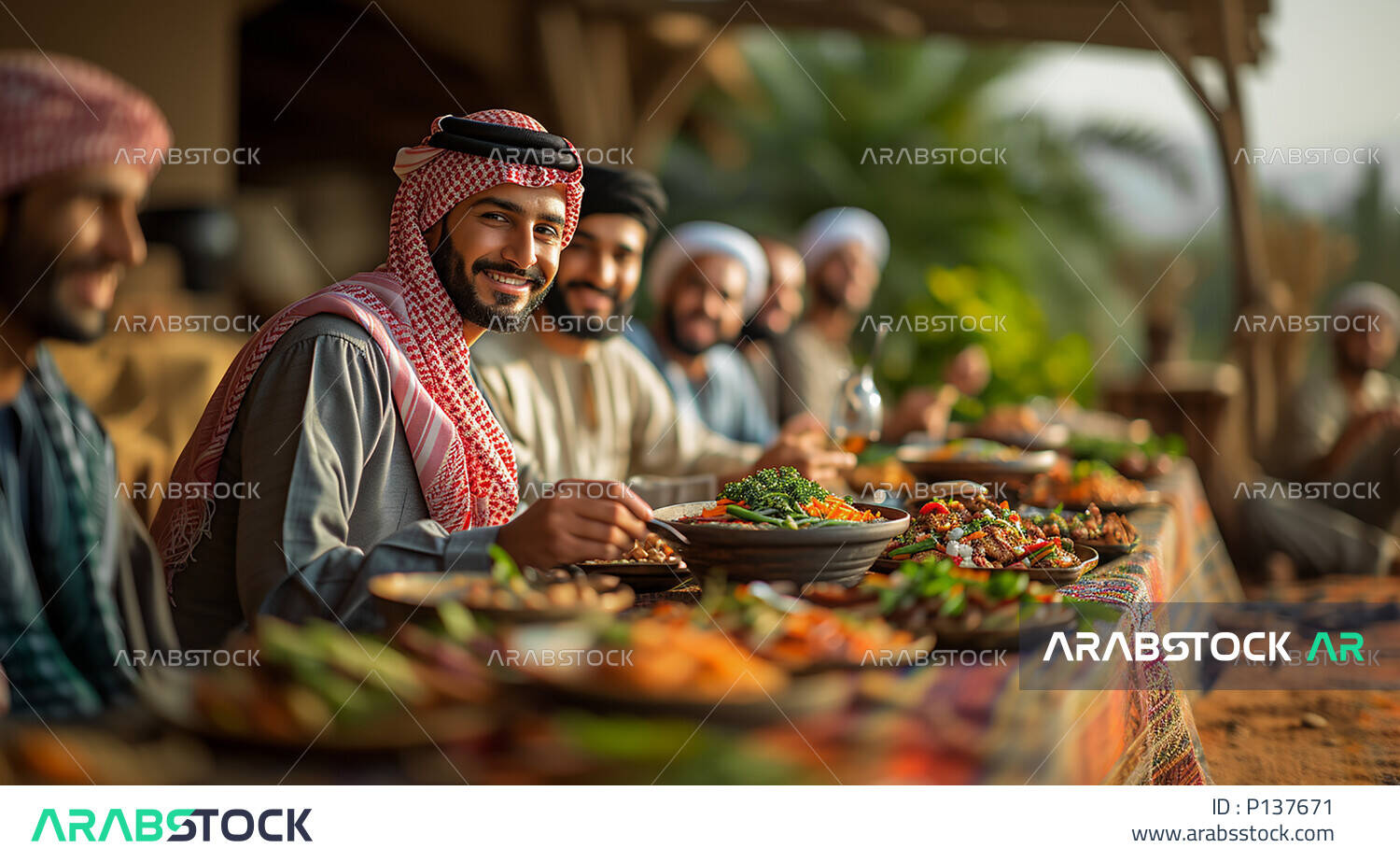 An iftar table full of delicious food, a group of Saudi Gulf Arab men ...