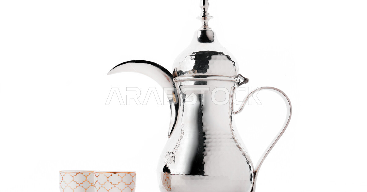 Old oriental Arab coffee pot made of copper in a traditional style ...