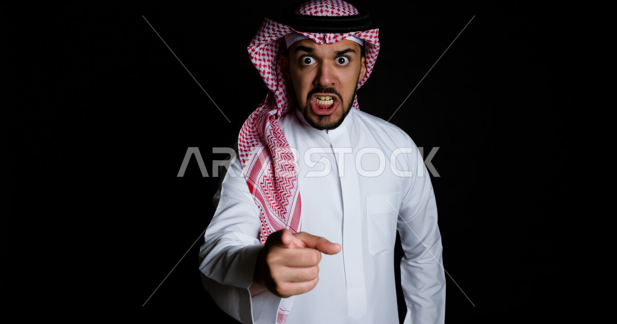 Portrait of a Saudi Gulf man angry and frowning with different face and ...