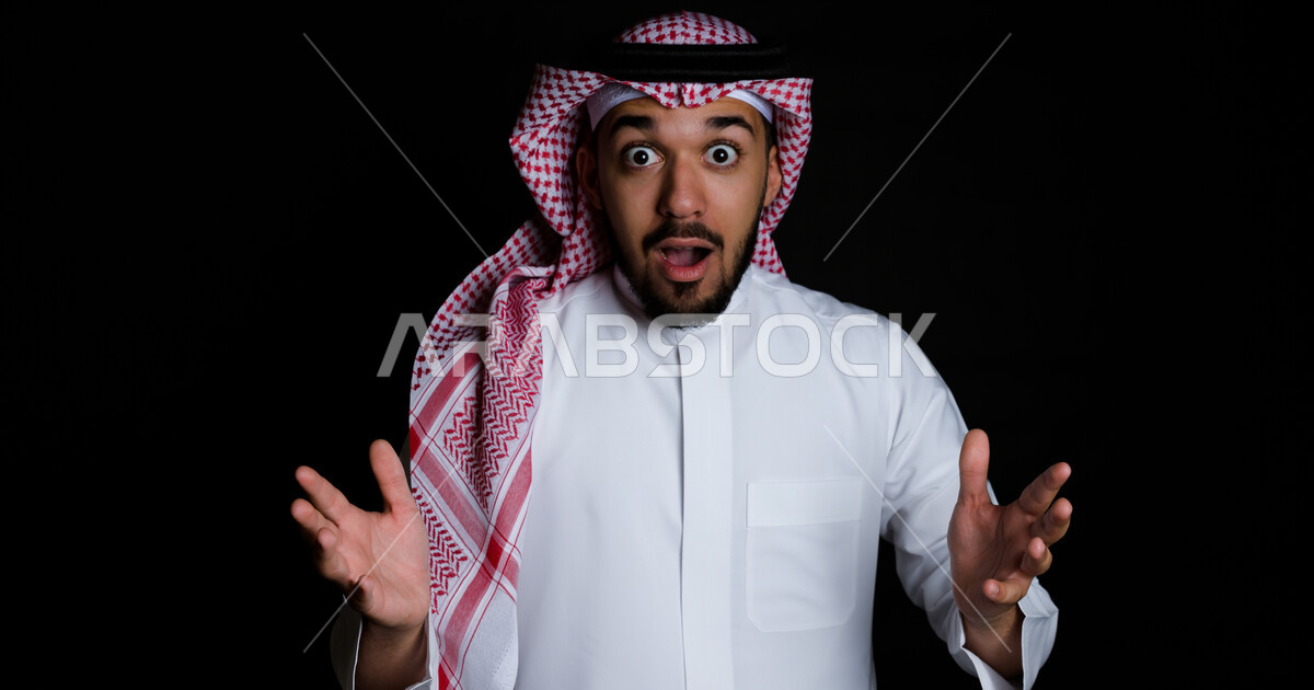 Portrait of a Saudi Gulf man amazed with facial and hands gestures ...