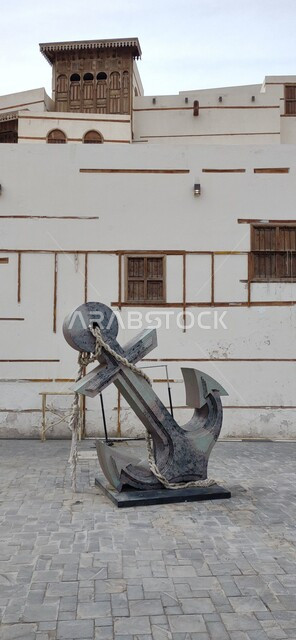 A model of a marine anchor in the historical city of Yanbu, mud houses ...